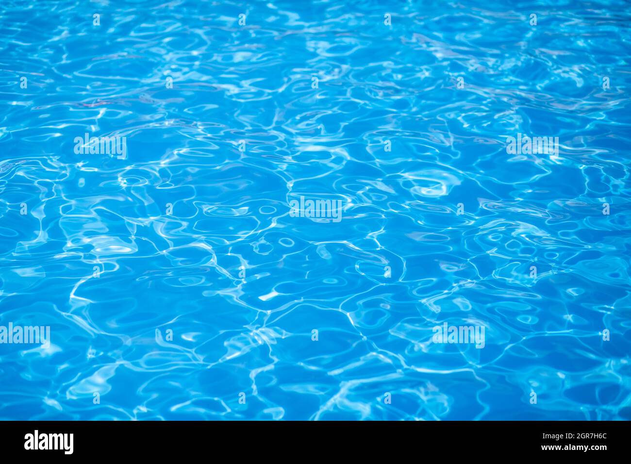 Water background, ripple and flow with waves. Summer blue swiming pool ...