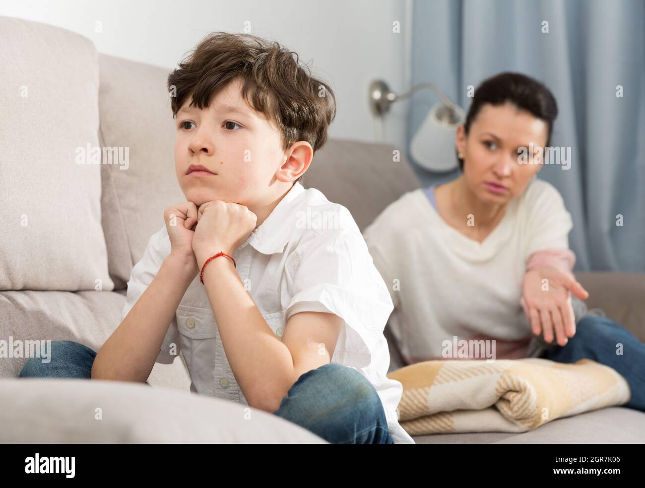 Troubled boy and mother scolding him Stock Photo - Alamy