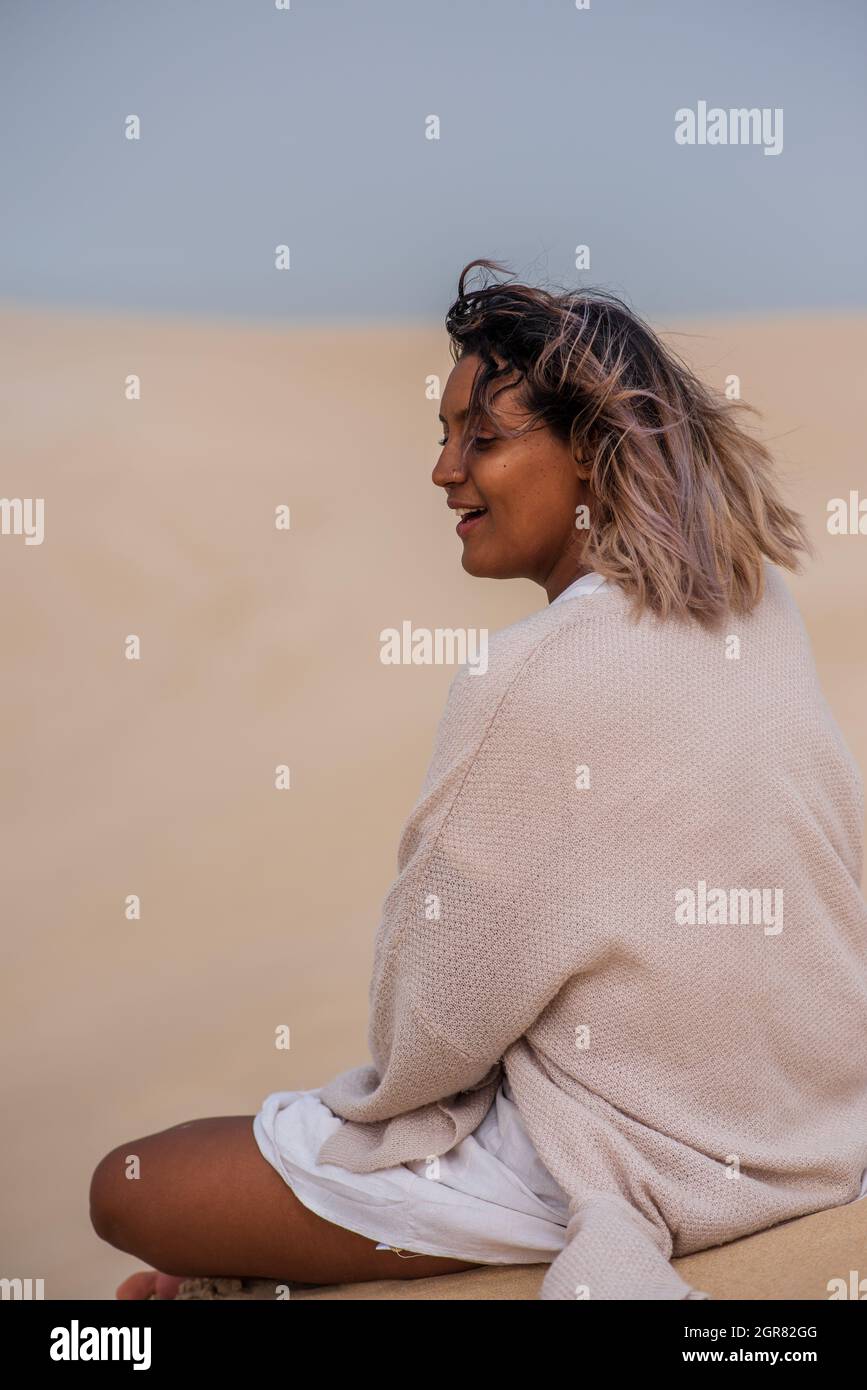 Woman sunbathing on sand dune hi-res stock photography and images - Alamy