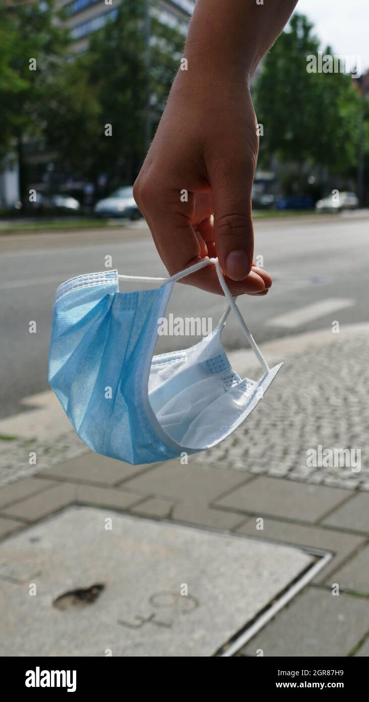 Hand held masks hi-res stock photography and images - Alamy
