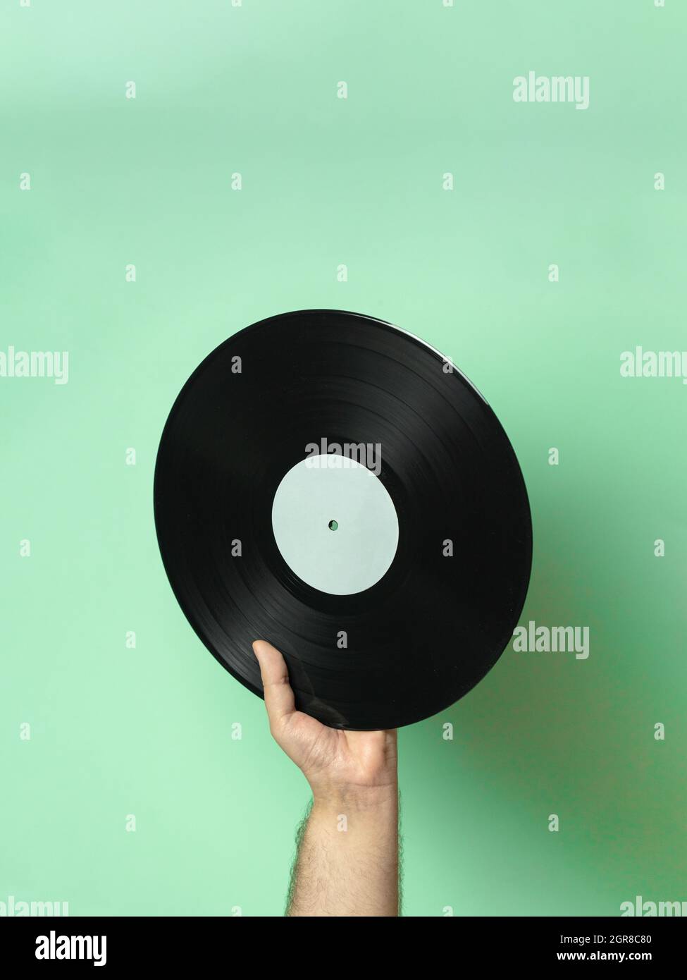 Hand Holding Vinyl Record Stock Photo - Alamy