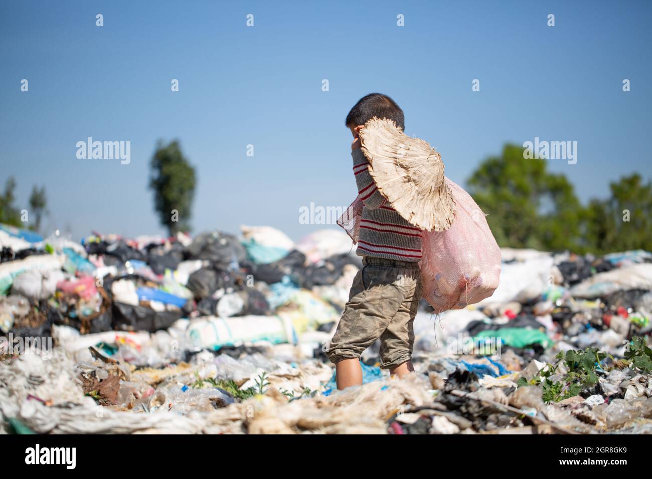 Children collect garbage hi-res stock photography and images - Alamy