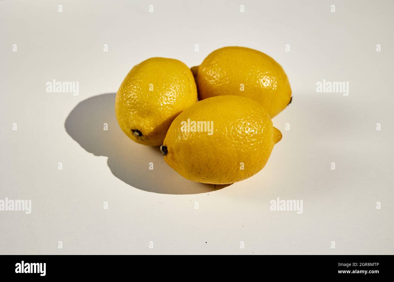Portret of three lemons isolated on white Stock Photo - Alamy