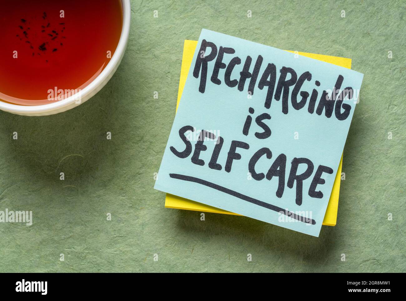 recharging is self care inspirational reminder note with a cup of red ...