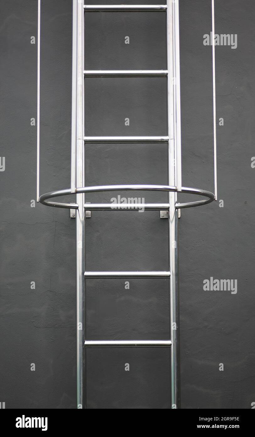 Metal ladder fixed to wall hi-res stock photography and images - Alamy