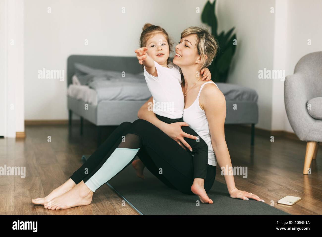 Girl hugging mothers leg hi-res stock photography and images - Alamy