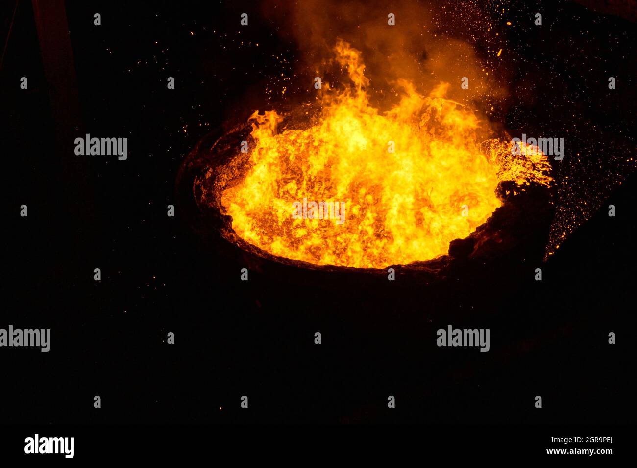 Boiling molten metal in a metallurgical ladle Stock Photo - Alamy
