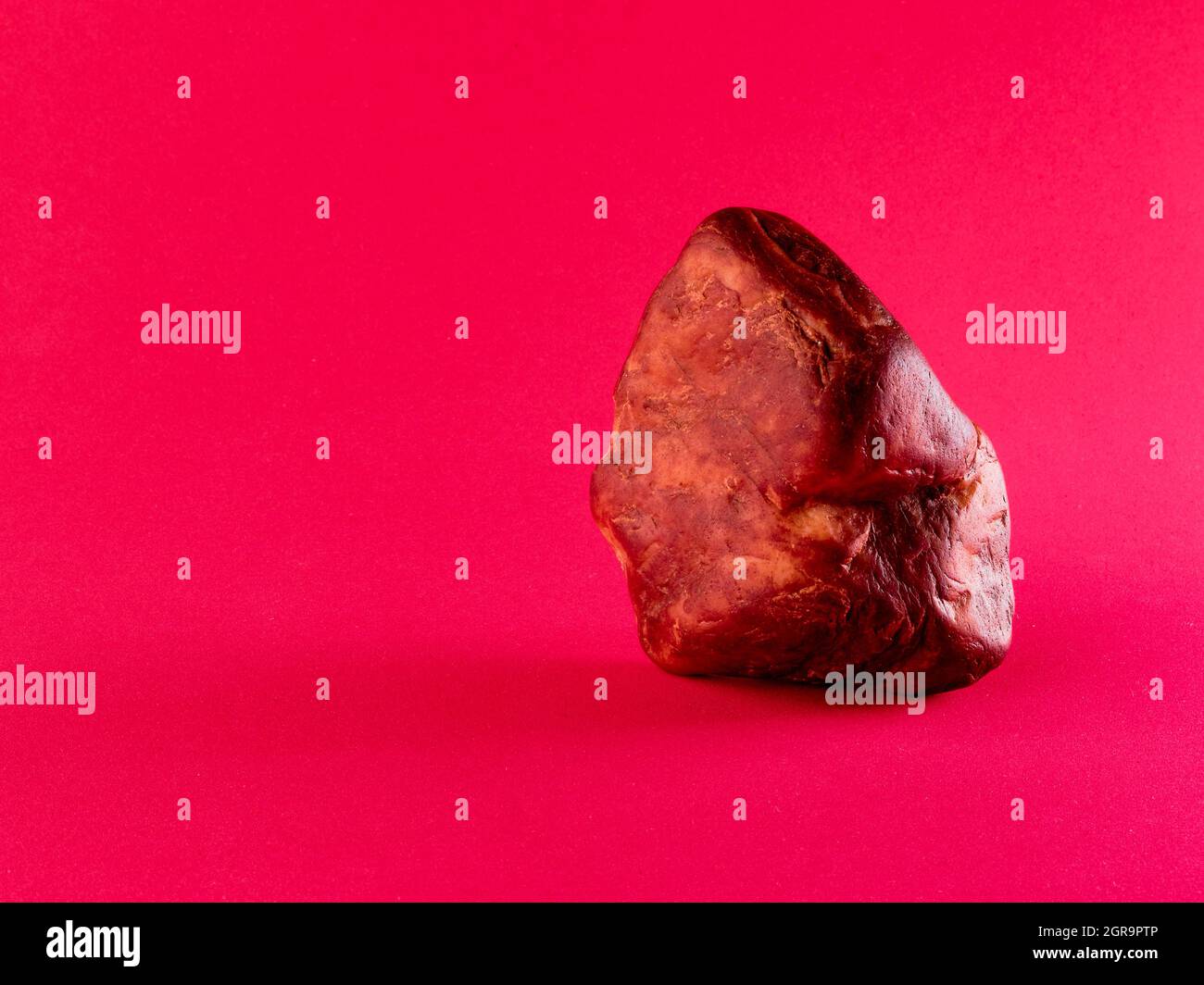 marble red stone in red background Stock Photo - Alamy