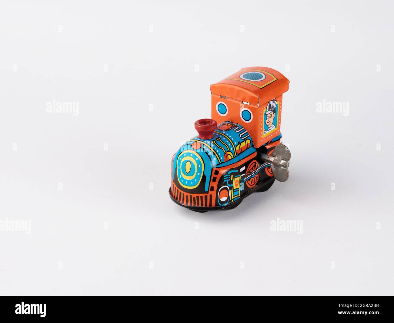 Old design train toy. Isolated metal colors train toy profile view ...
