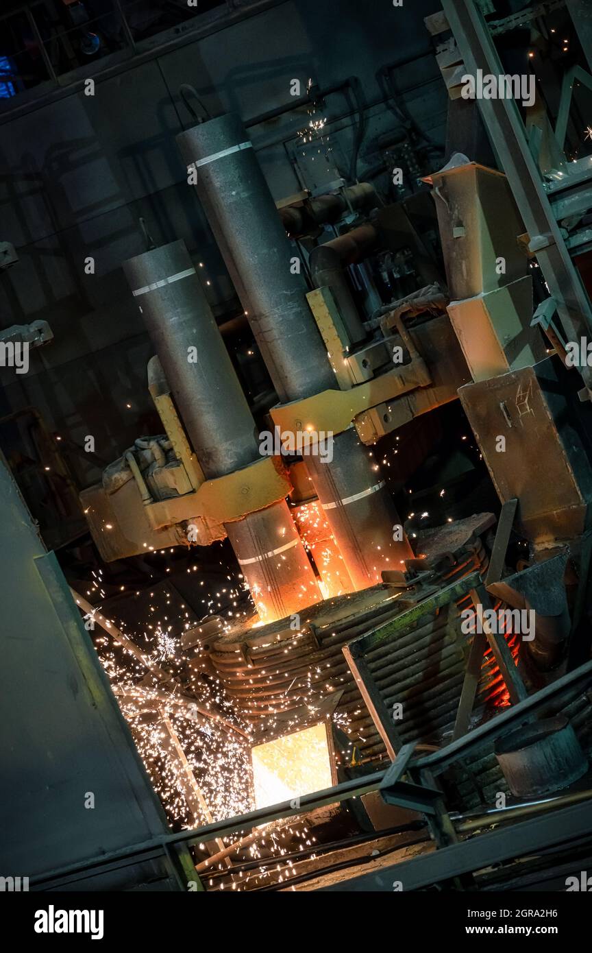 Electric arc steelmaking furnace, thick powerful red-hot graphite ...