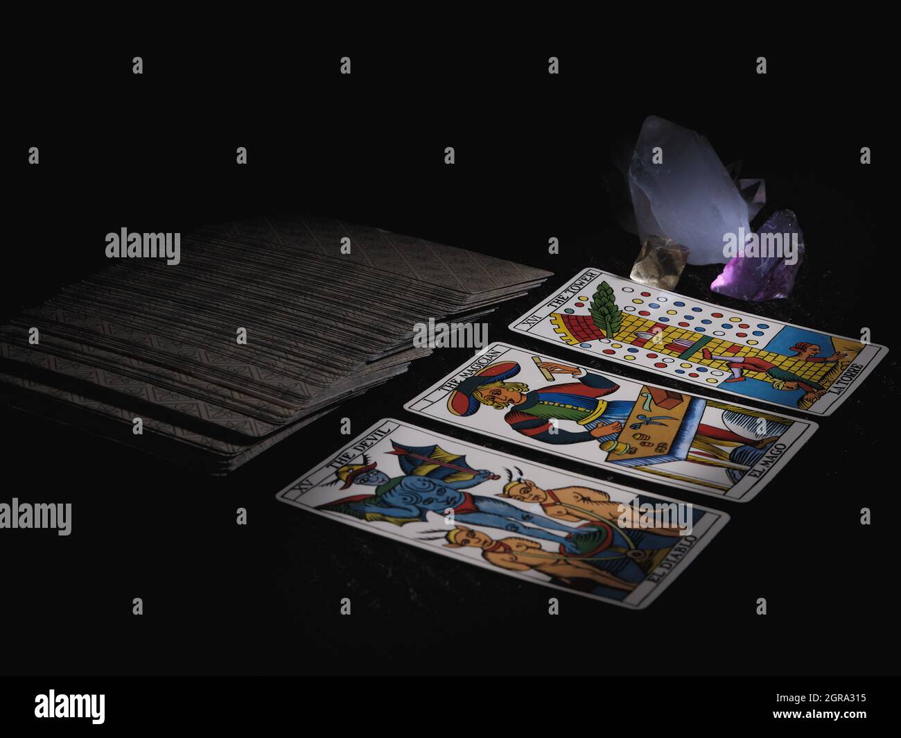 tarot cards fortune telling concept dark background with magic stones ...