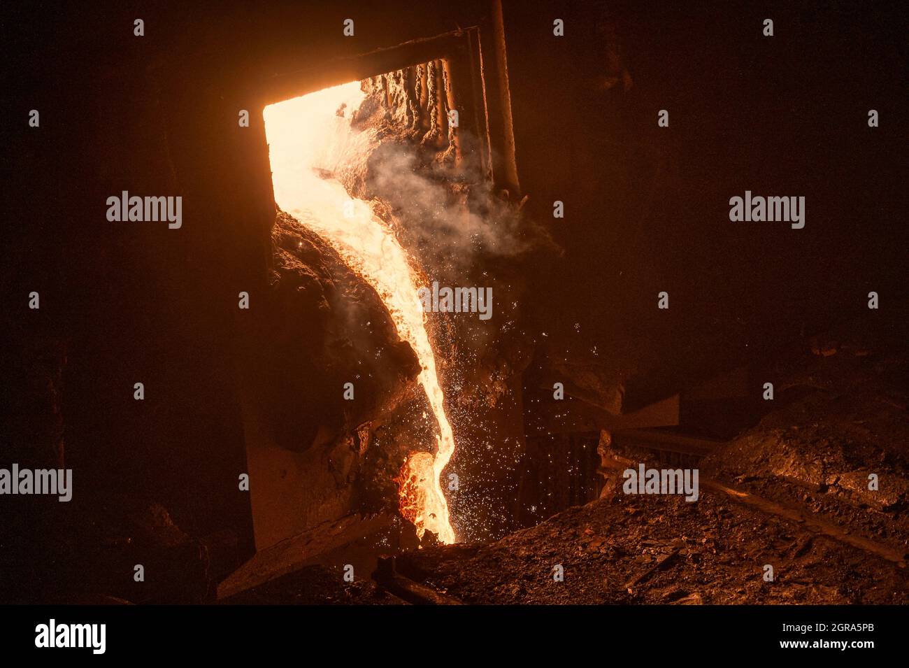 Discharge of liquid metal from a metallurgical furnace Stock Photo - Alamy