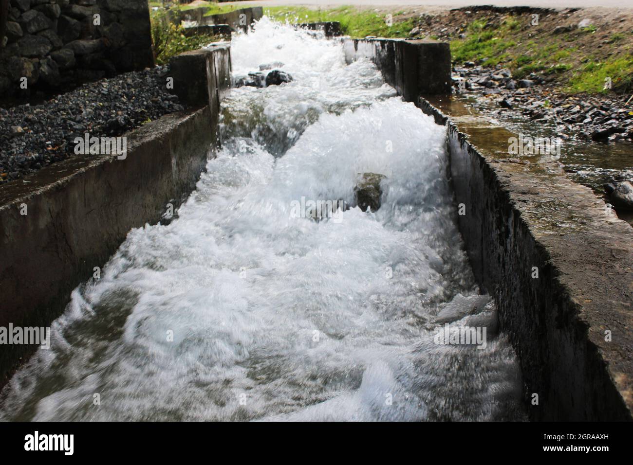 Speed moving water through a canal Stock Photo - Alamy