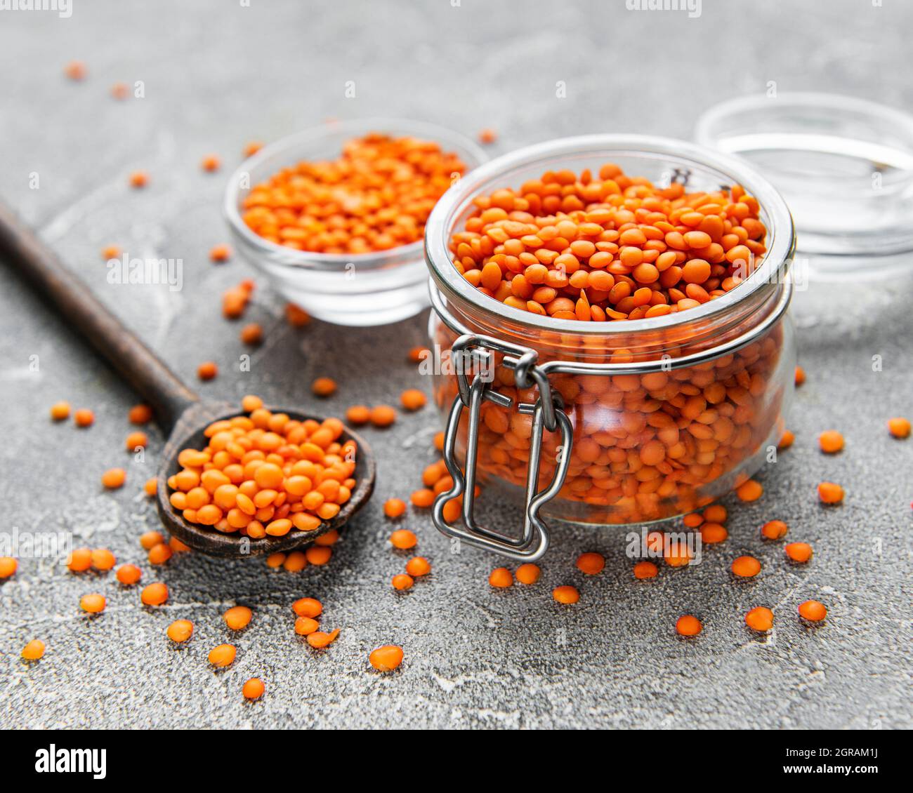 Organic healthy red lentils in glass jar on a table Stock Photo - Alamy
