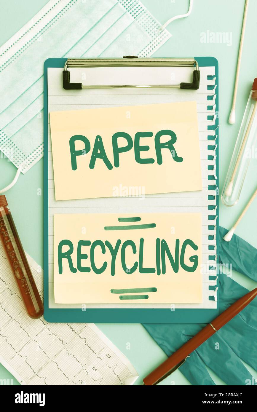 Hand writing sign Paper Recycling. Word Written on Using the waste ...