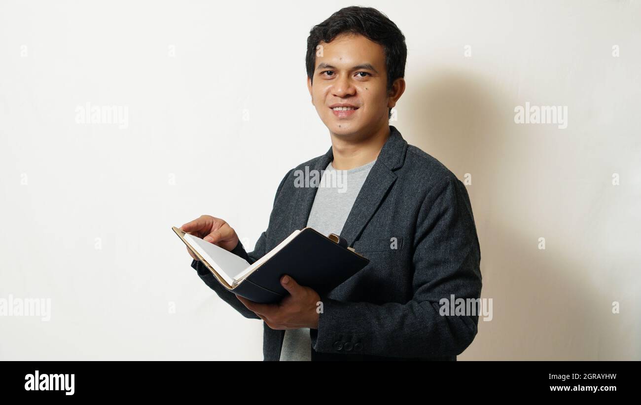 Portrait of Student Holding Book Stock Photo - Alamy