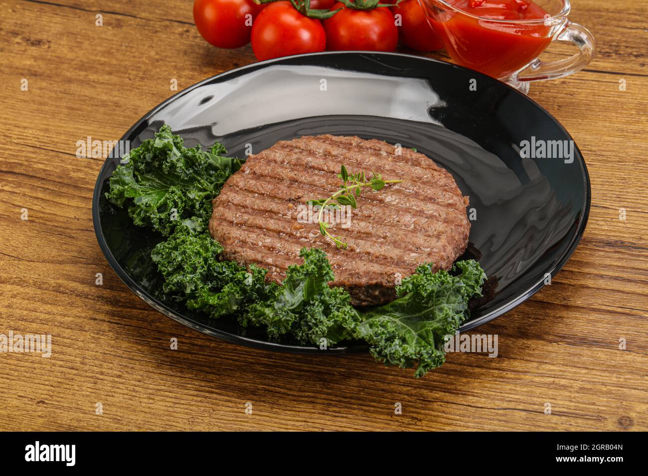 Grilled tasty beef cutlet for burger Stock Photo - Alamy