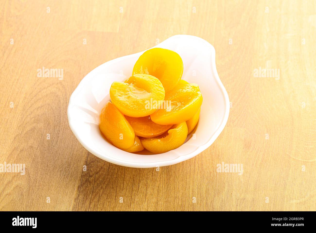 Canned apricot – sweet light dessert in the bowl Stock Photo - Alamy