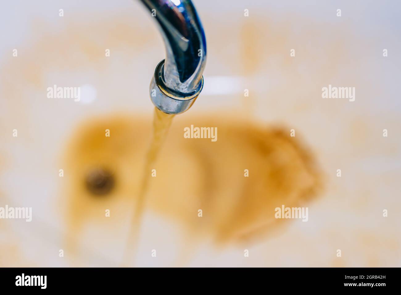 Rusty water flows from the faucet in the bathroom Stock Photo - Alamy