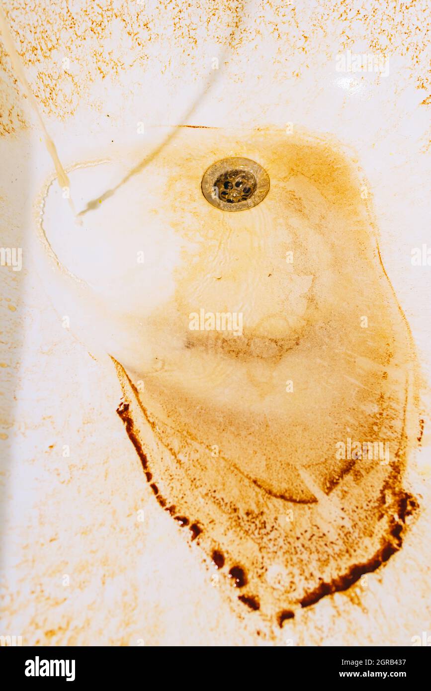 Rusty water flows from the faucet in the bathroom Stock Photo - Alamy