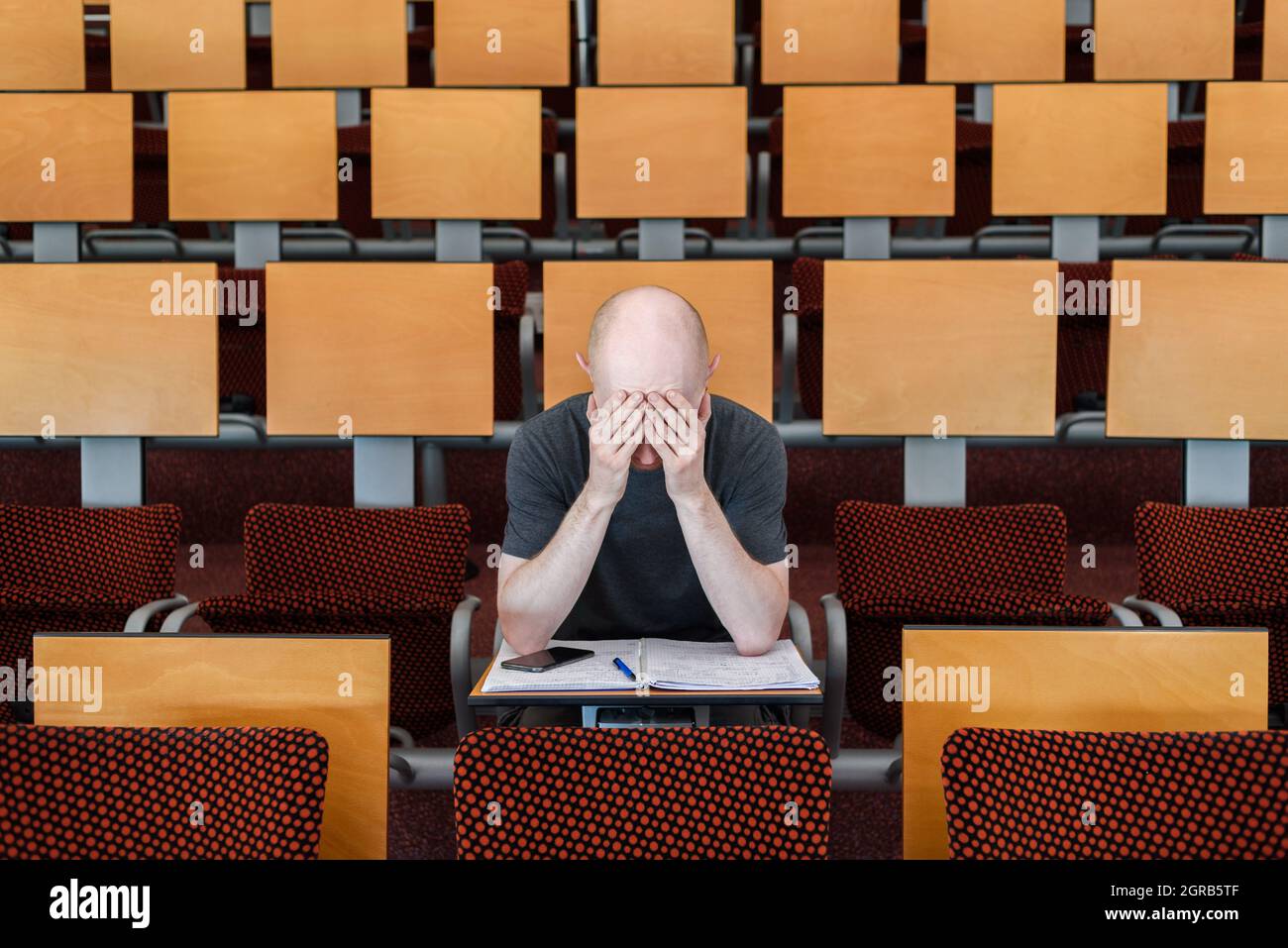 Man sitting alone in auditorium hi-res stock photography and images - Alamy