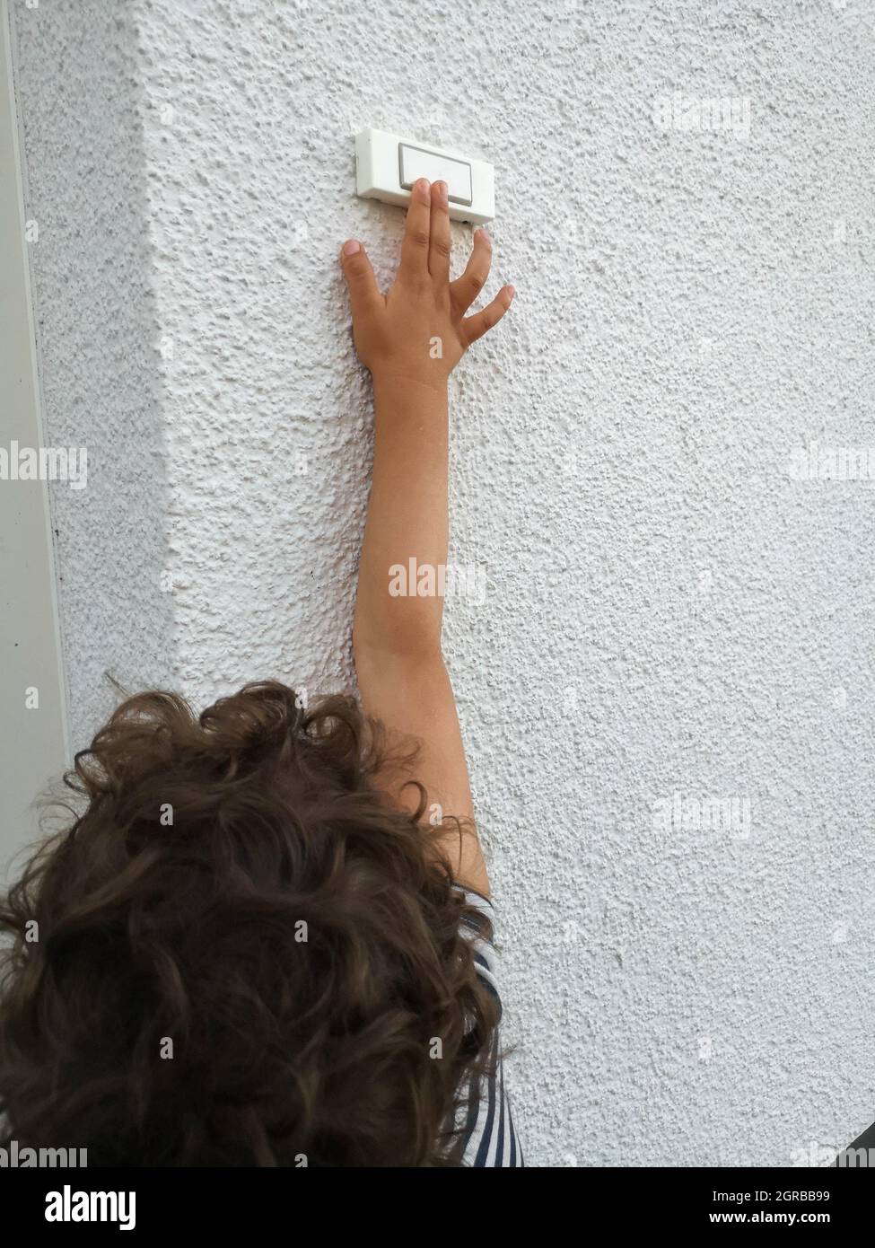 Ringing doorbell rear view hi-res stock photography and images - Alamy