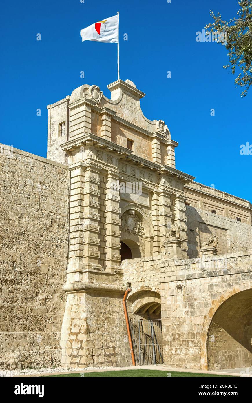 Narrow stone bridge and the Mdina Gate, the entrance to the citadel of ...