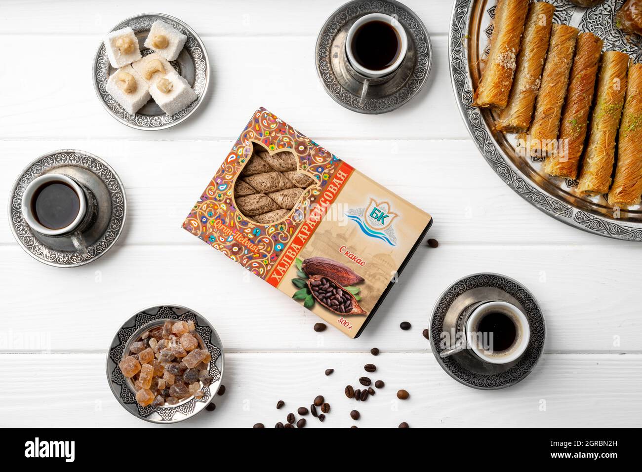 Top view of Turkish sweets and Turkish coffee on white wooden ...