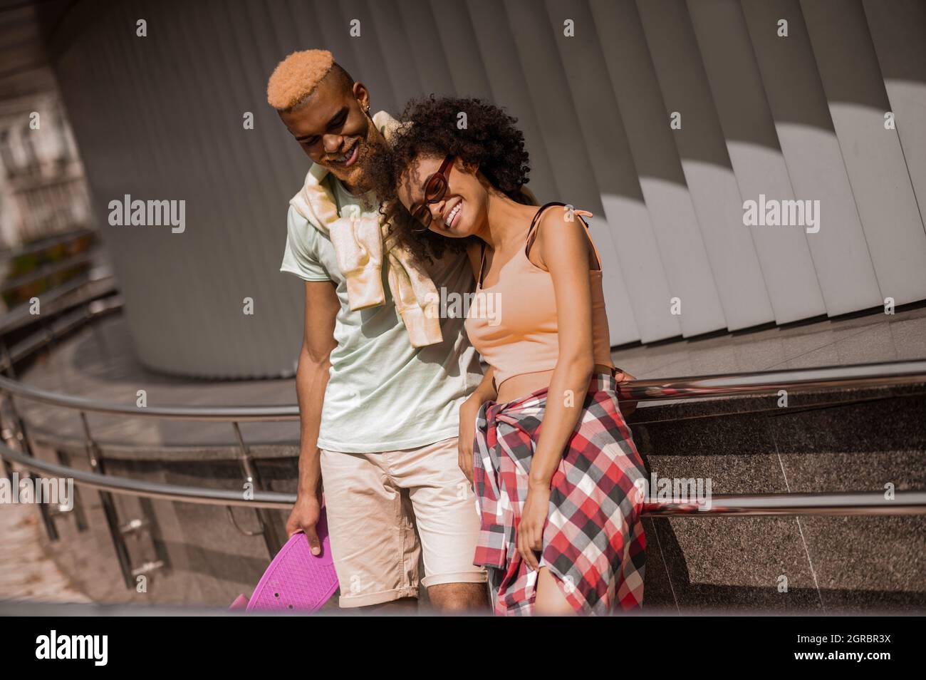 Young dark-skinned couple enjoying the day together Stock Photo - Alamy