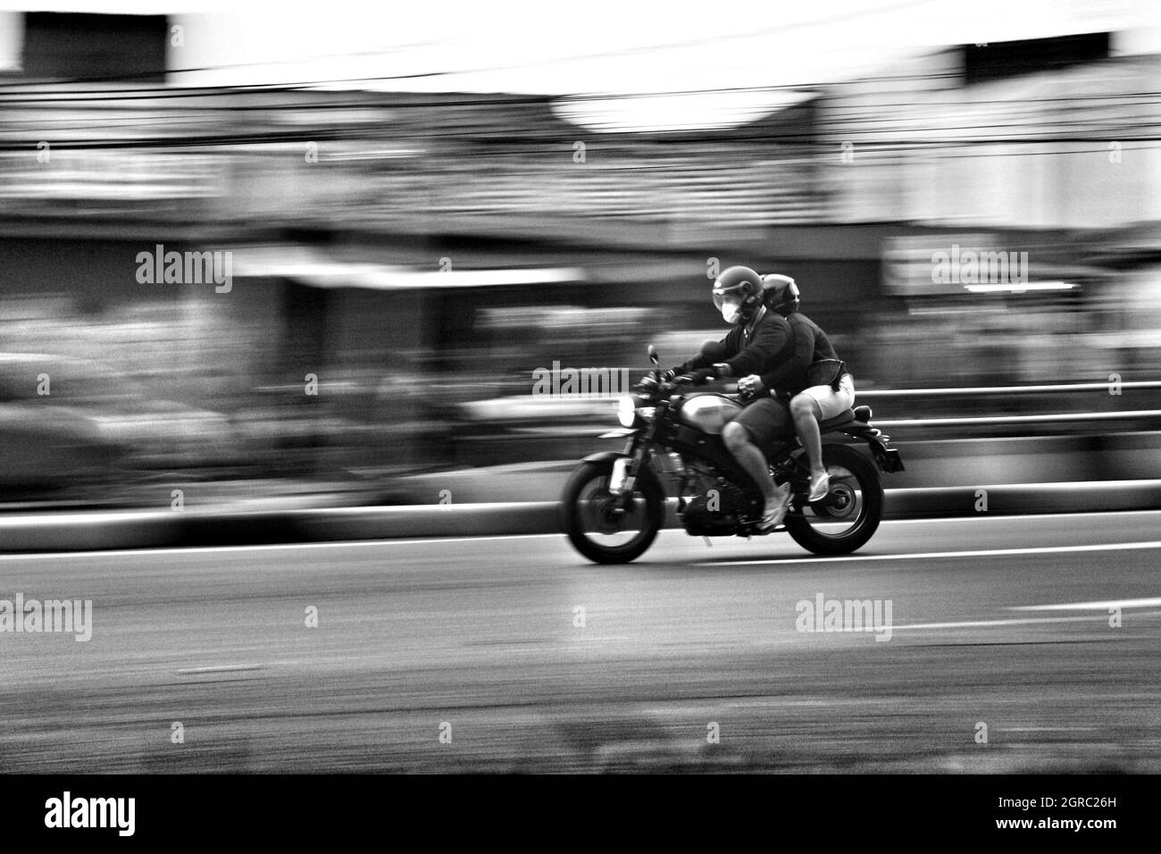 Black sports person in bicycle hi-res stock photography and images - Alamy