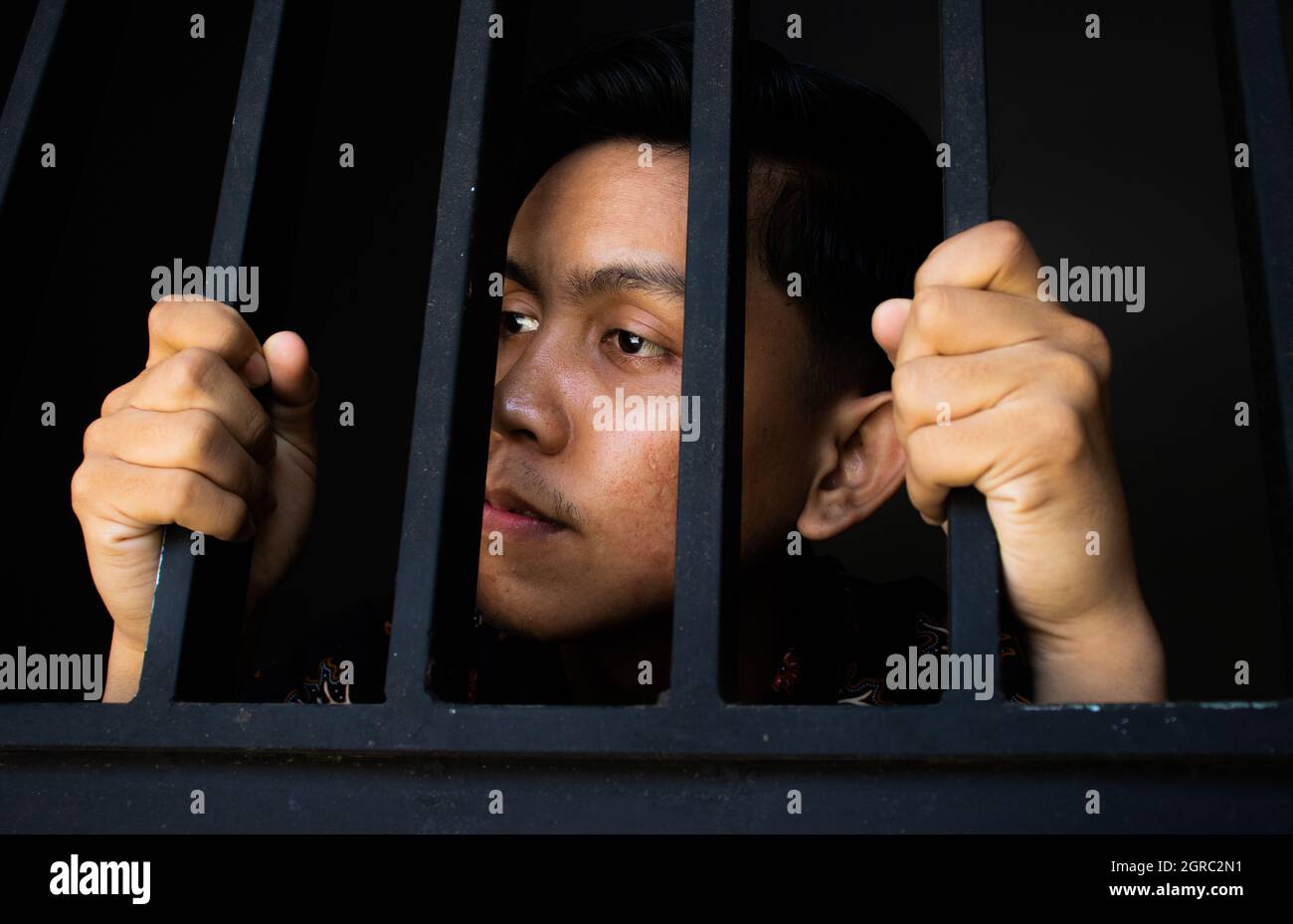 Man Looking Through Prison Bars High Resolution Stock Photography and ...