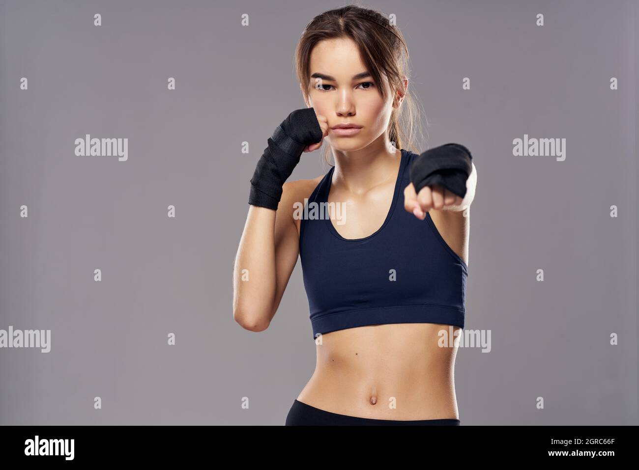 beautiful woman hand bandages punch workout fighter dark background ...