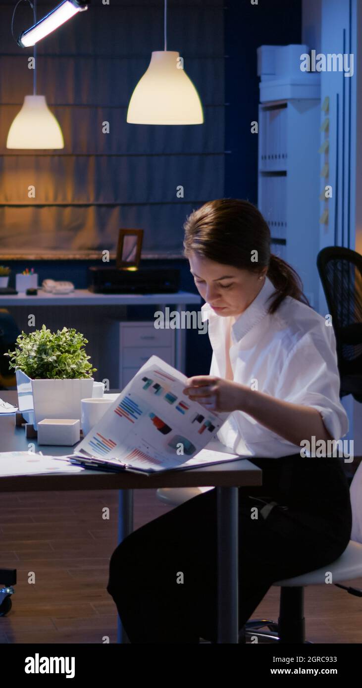 Businesswoman enter in company office meeting room late at night ...