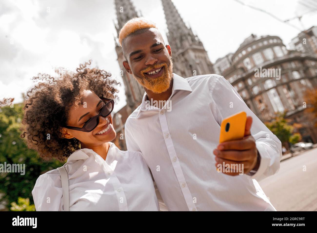A cute young couple looking happy and excited Stock Photo - Alamy