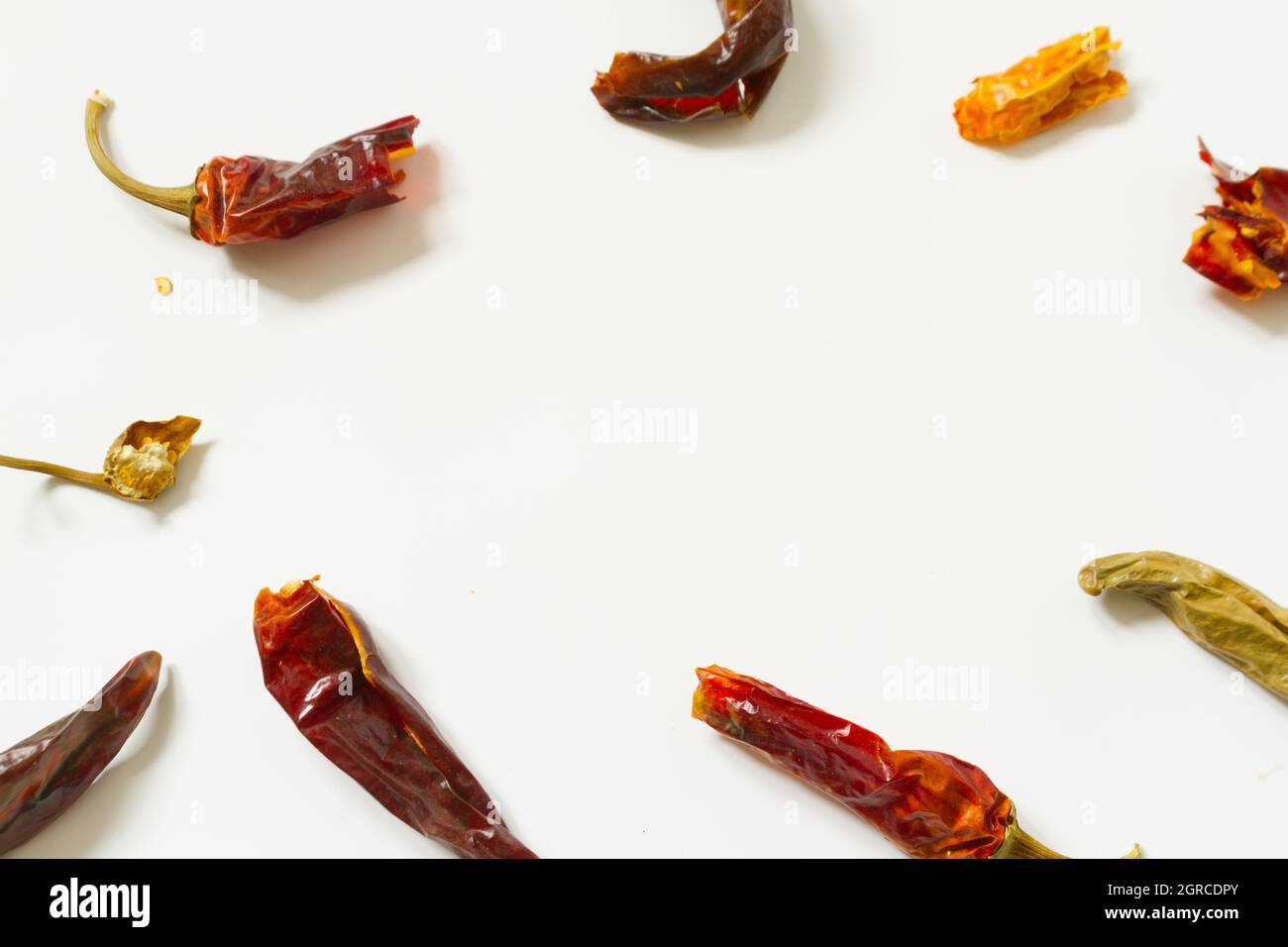 Dry Chilli peppers on white background Stock Photo - Alamy
