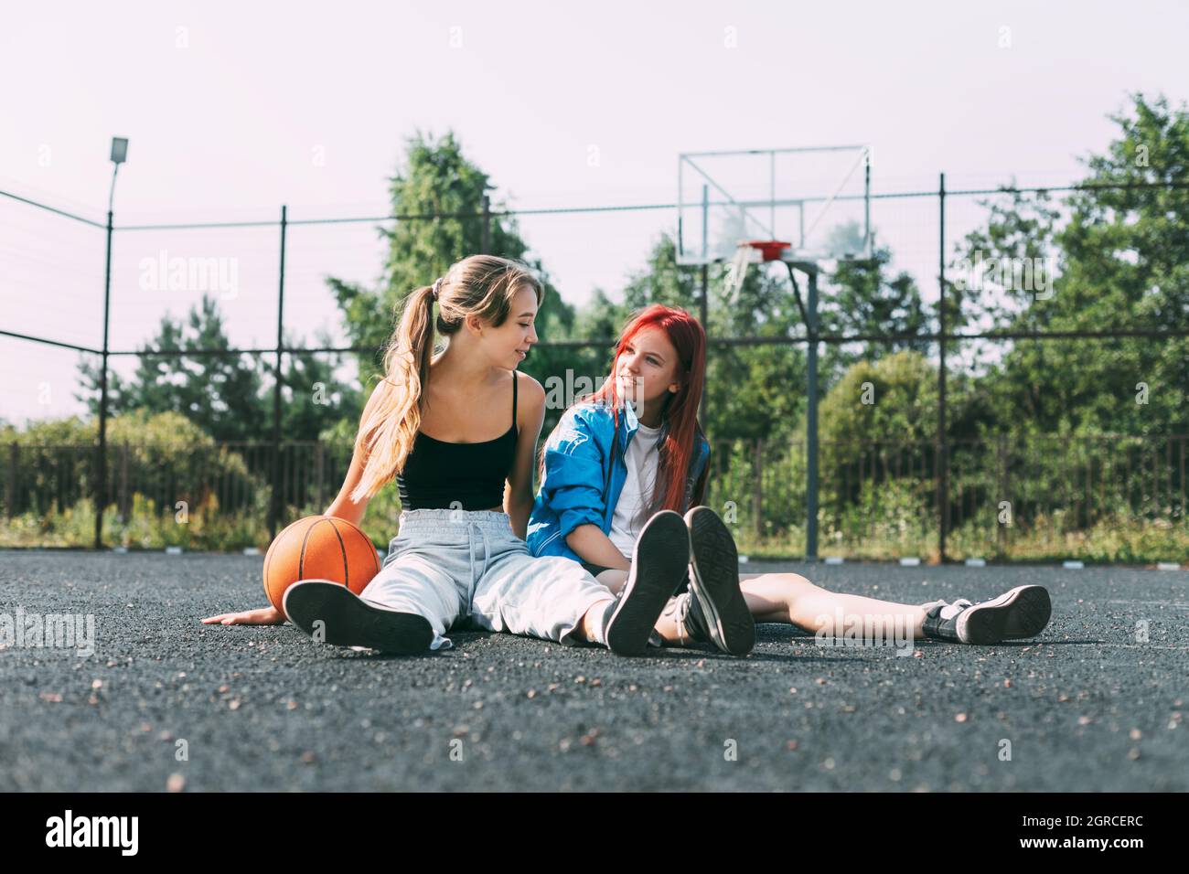 Portrait girl sitting on basketball hi-res stock photography and images ...