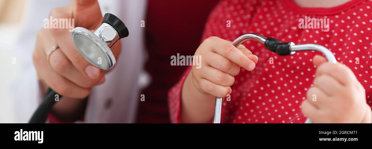 Little child with stethoscope at doctor reception Stock Photo - Alamy