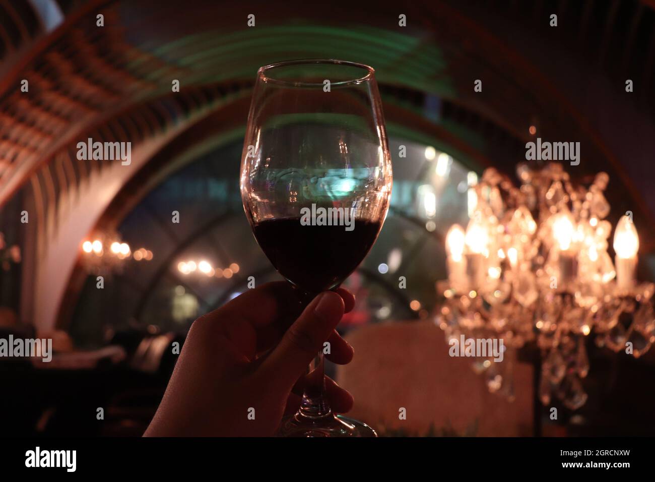 Hand raising a glass hi-res stock photography and images - Alamy