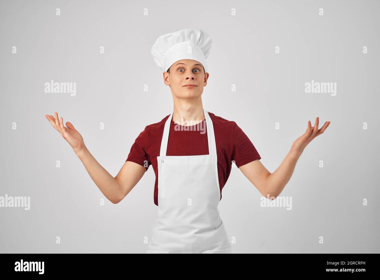 male chef with a cap on his head kitchen work Stock Photo - Alamy