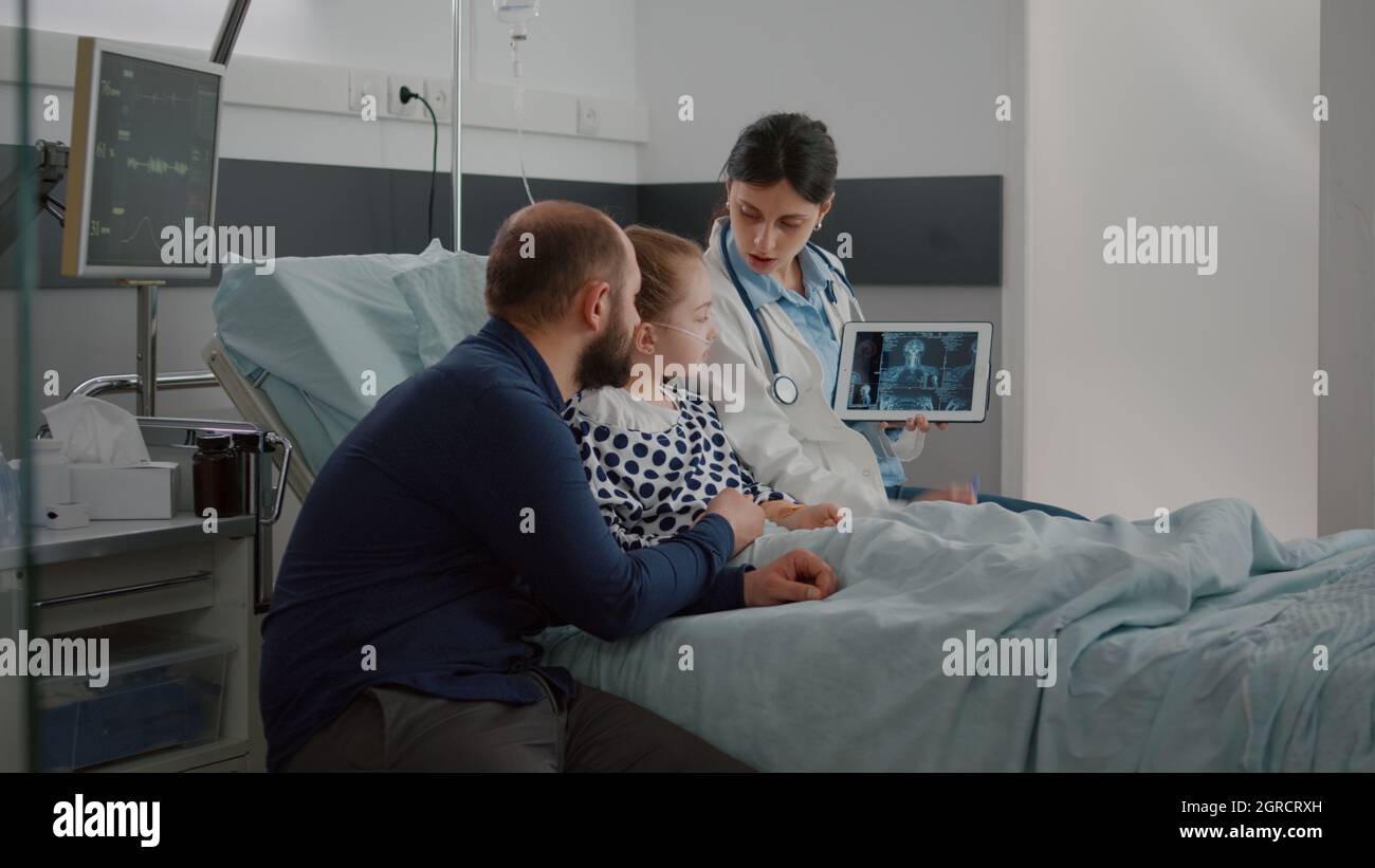 Physician woman doctor explaining medical radiography discussing ...
