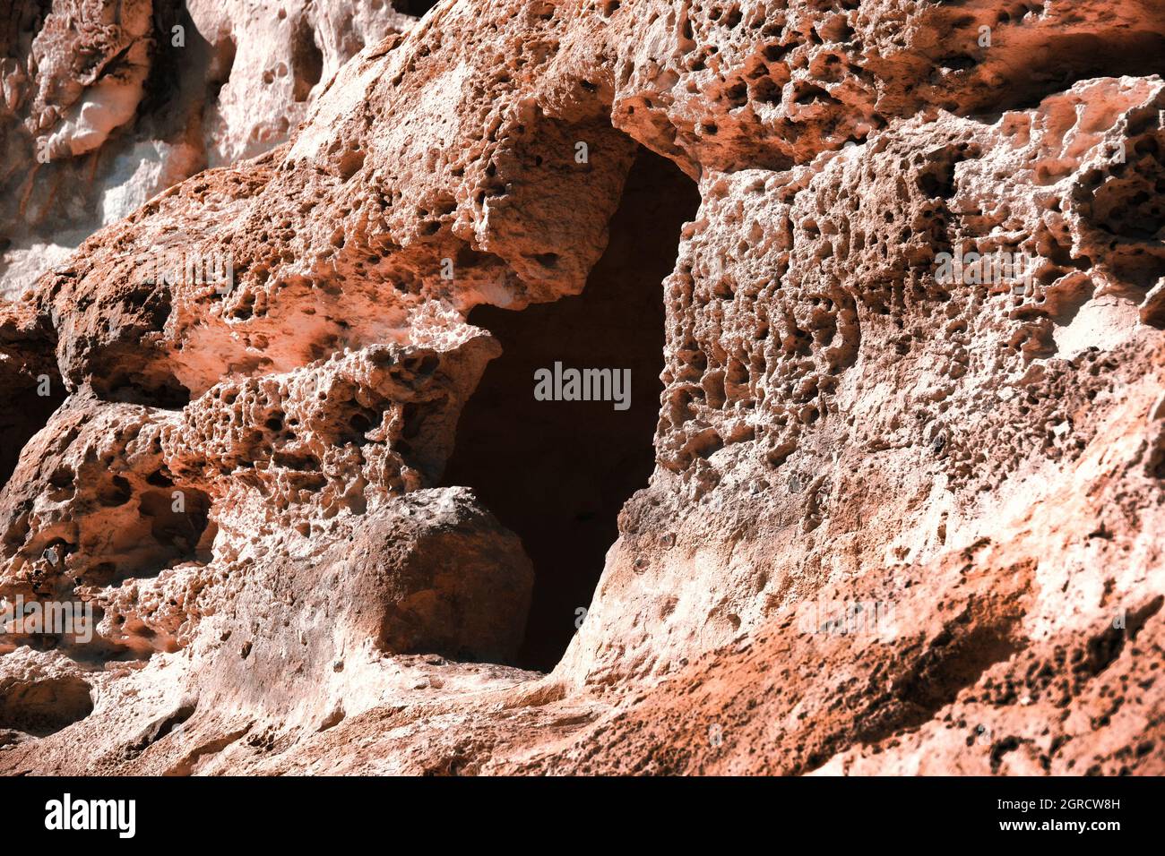 Entrance to a man-made cave in a limestone rock. A place of refuge for ...