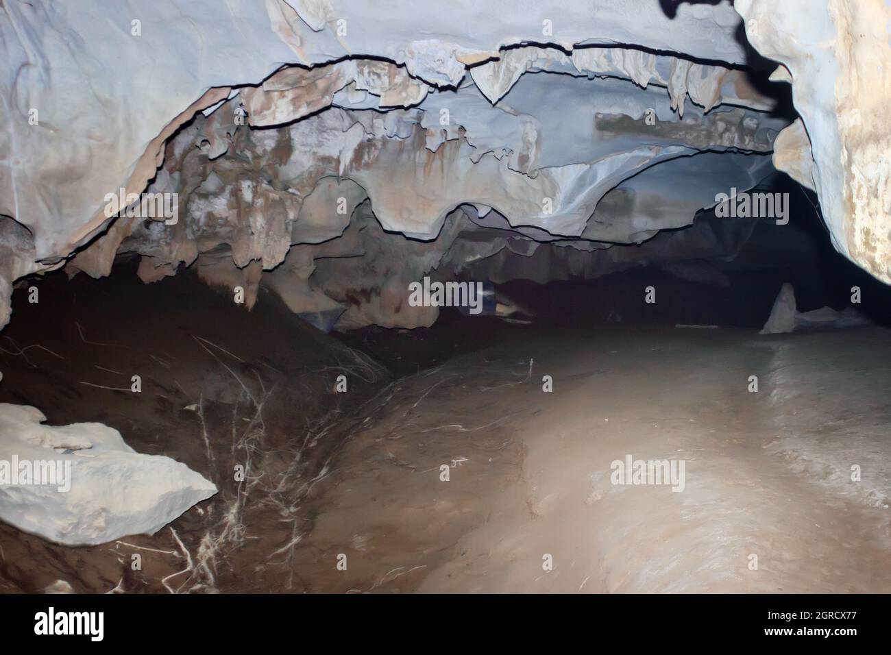 Speleology. Old cave washed by an underground river in the mountain ...