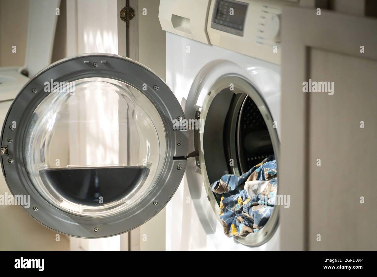 Washing machine with open door at home Stock Photo - Alamy