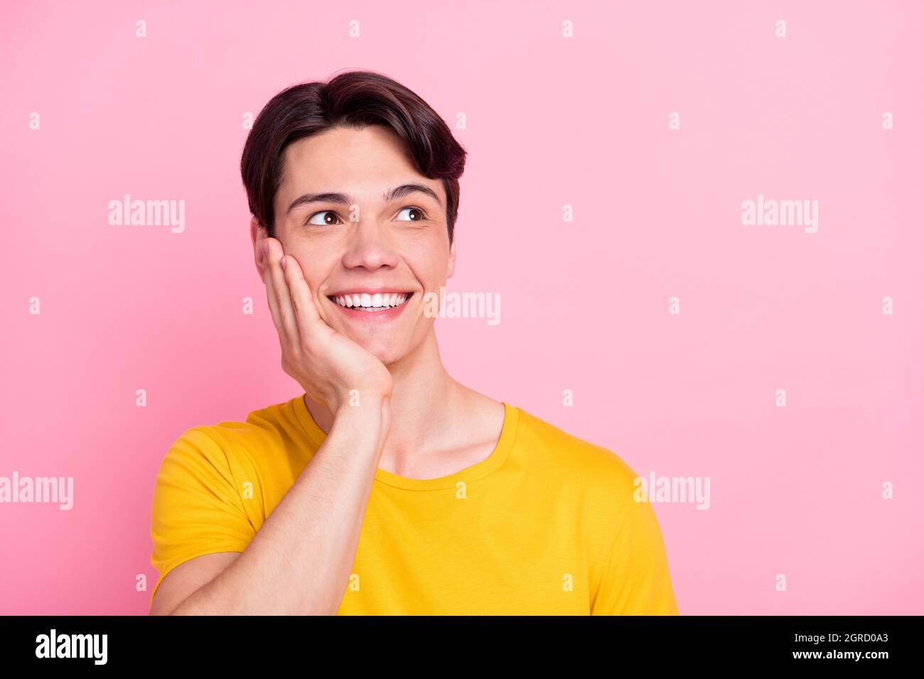 Photo of cute charming young guy dressed yellow t-shirt arm cheek ...