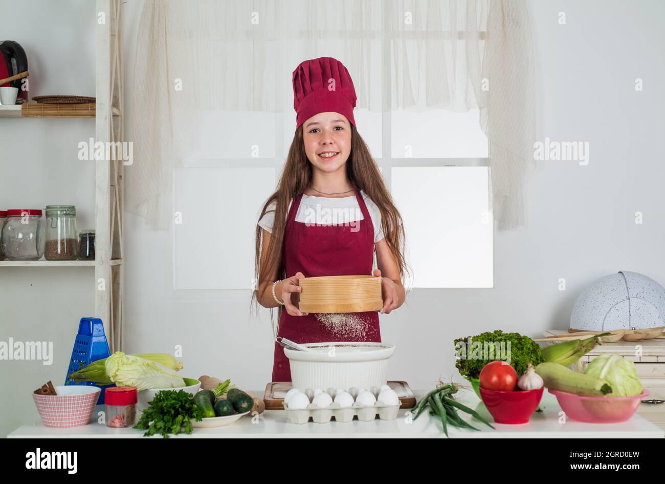 teen girl in cook uniform prepare food in kitchen, culinary Stock Photo ...