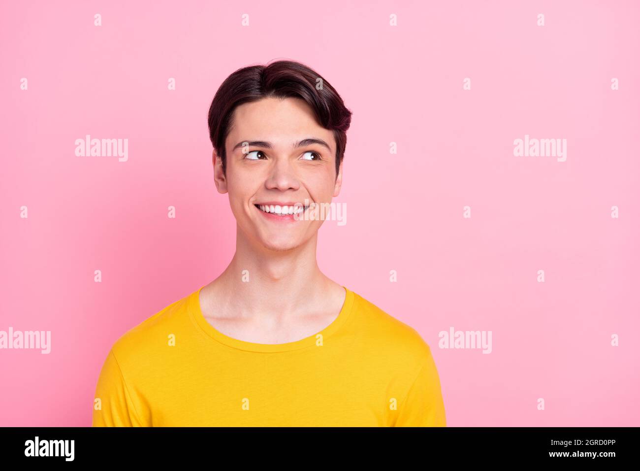 Photo of curious smart guy look empty space think thoughts wear yellow ...