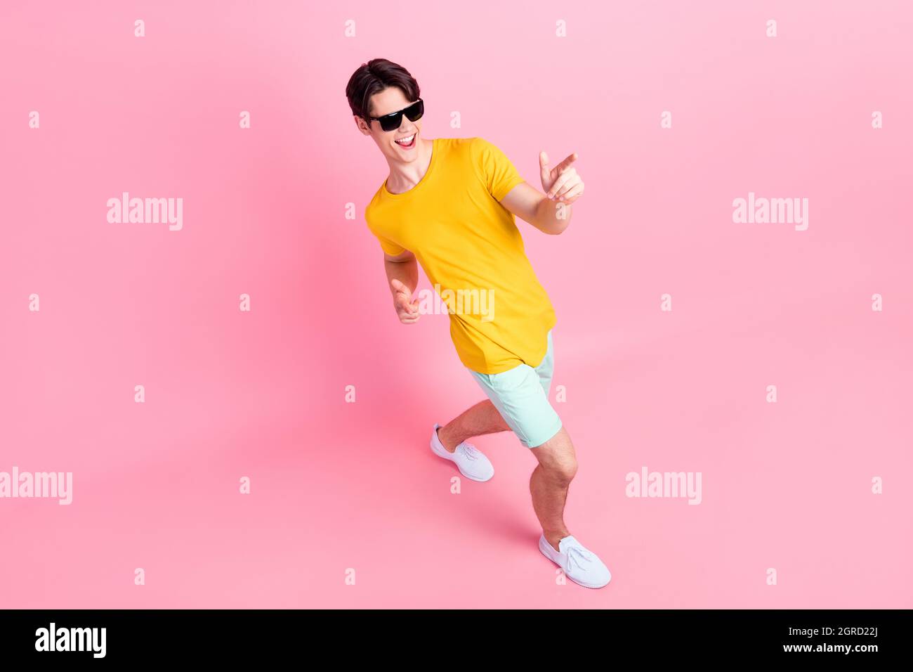 Top above high angle full length photo of young guy happy smile go walk ...
