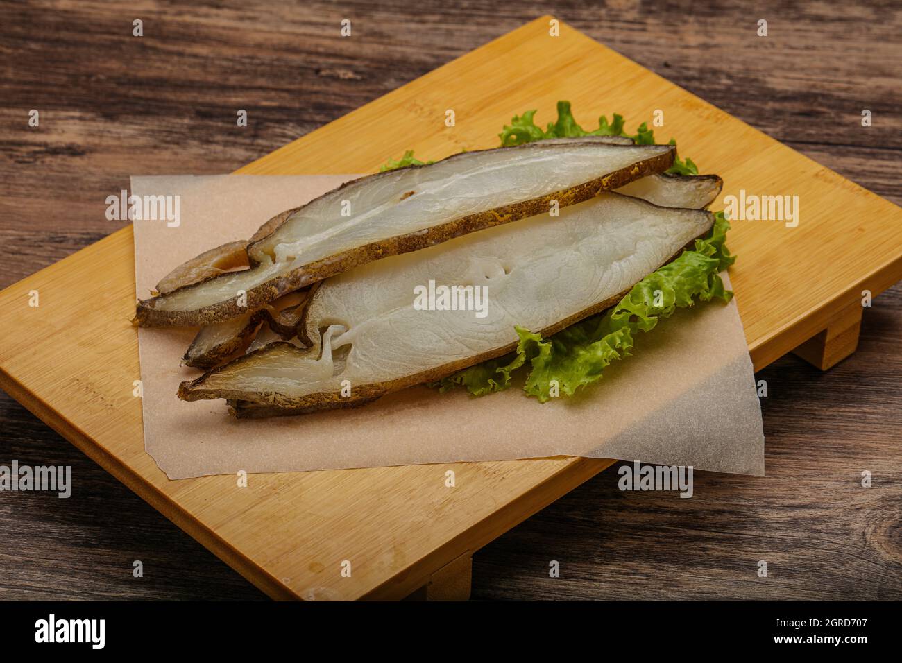 Delicous smoked halibut fish slices snack Stock Photo - Alamy