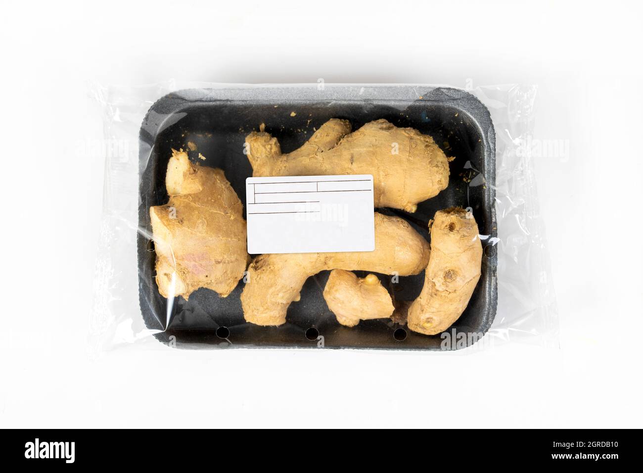 Freshly harvested ginger in a labeled pack on white background Stock ...