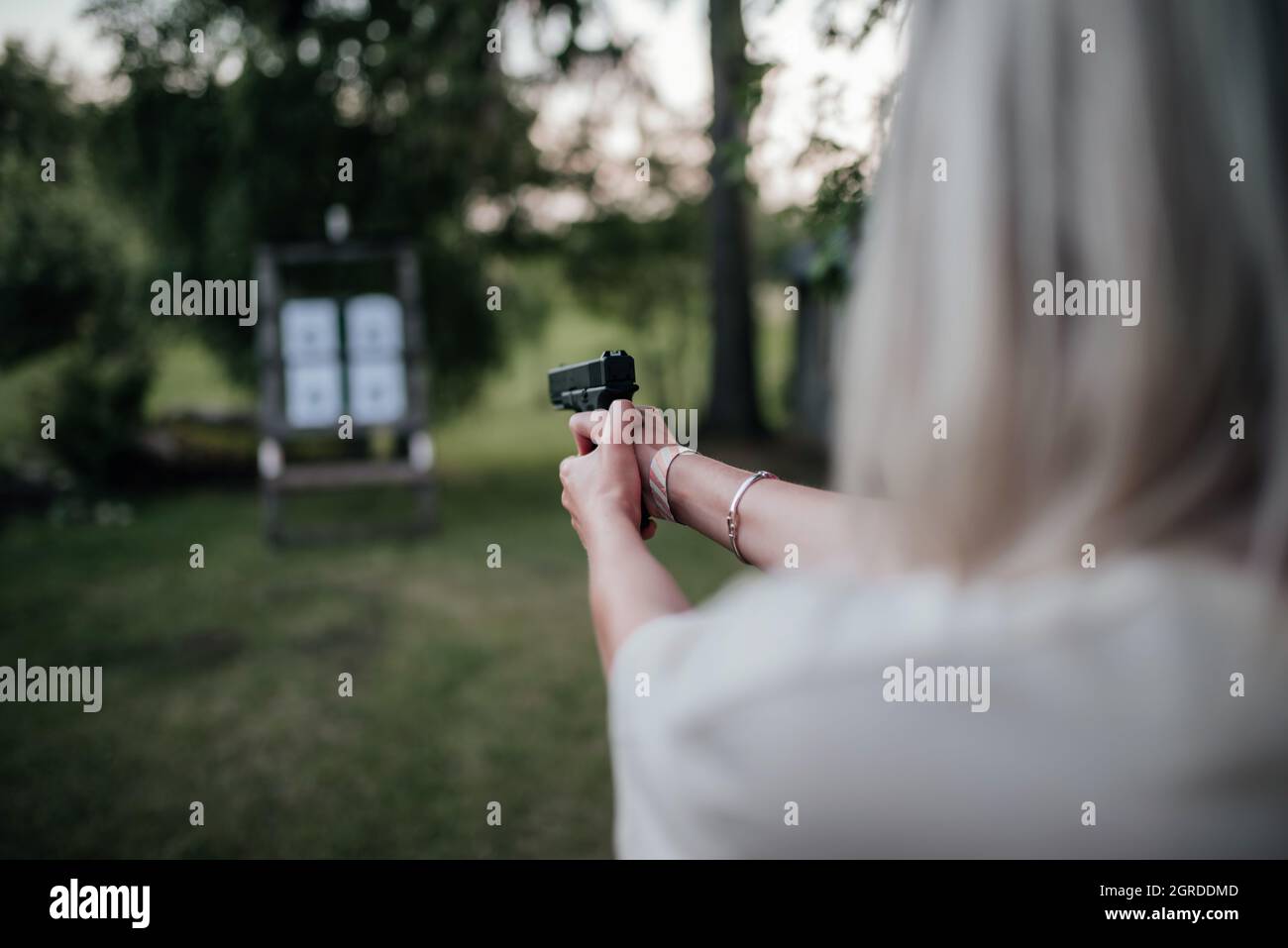 Blond women with gun hi-res stock photography and images - Alamy